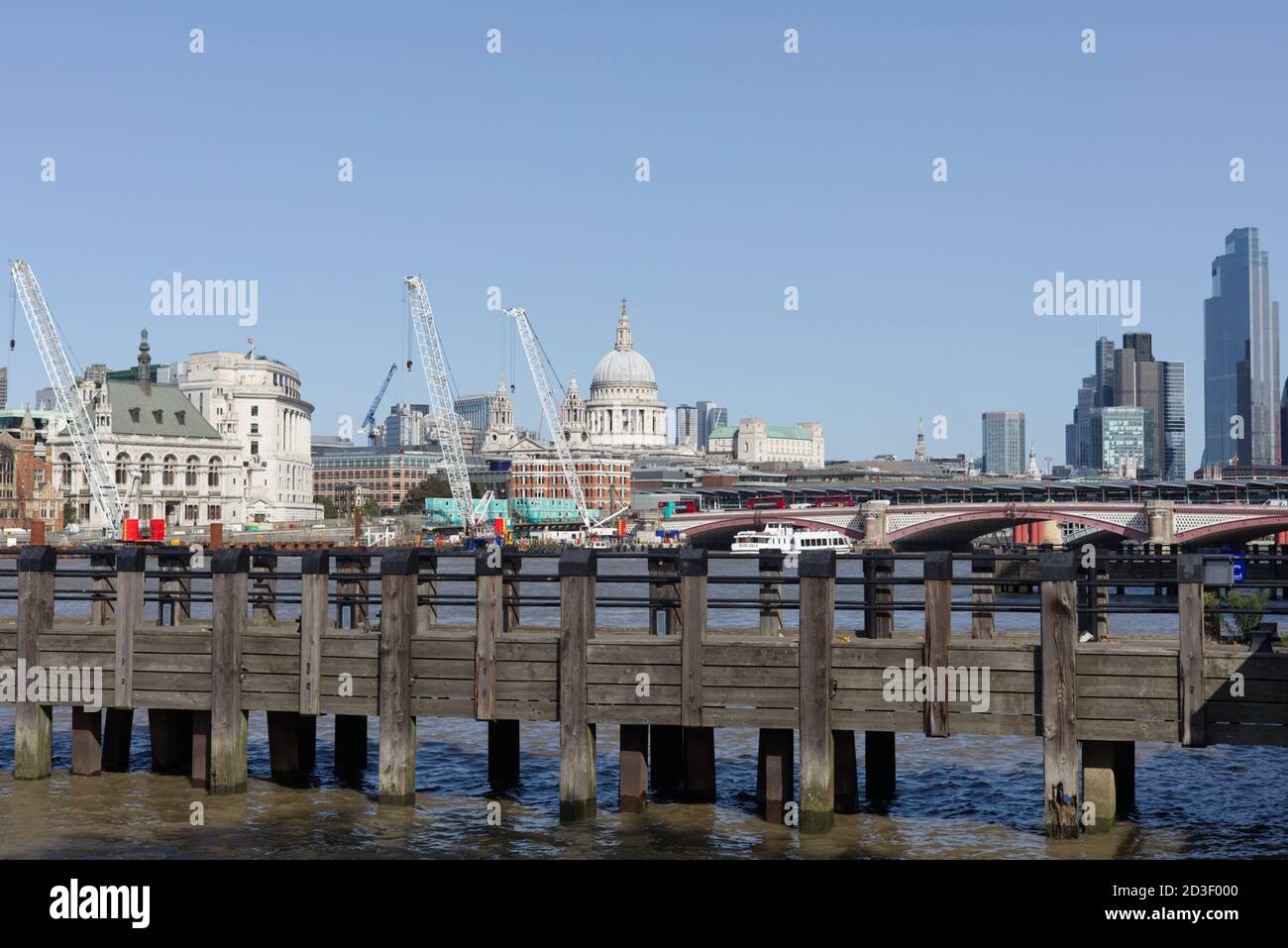 wooden jetty over the river Thames with lambeth bridge in the ...