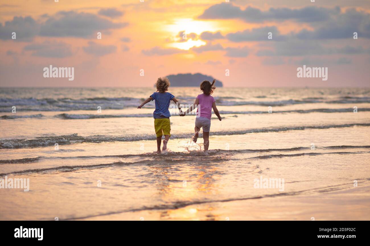 Happy boy jumping in waves hi-res stock photography and images - Alamy