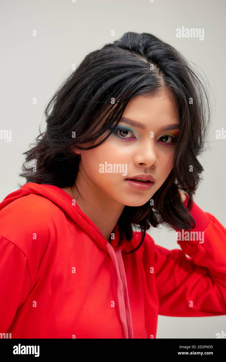 portrait of fashionable lady with artist and many colored nails ...