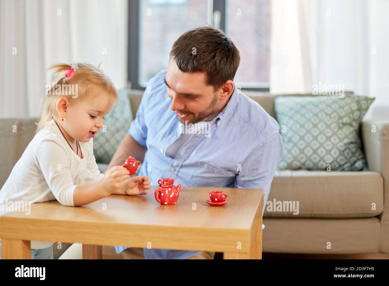 father and daughter playing tea party at home Stock Photo - Alamy