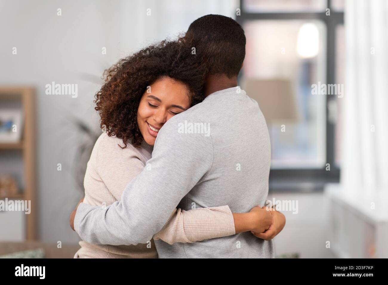 happy african american couple hugging at home Stock Photo - Alamy