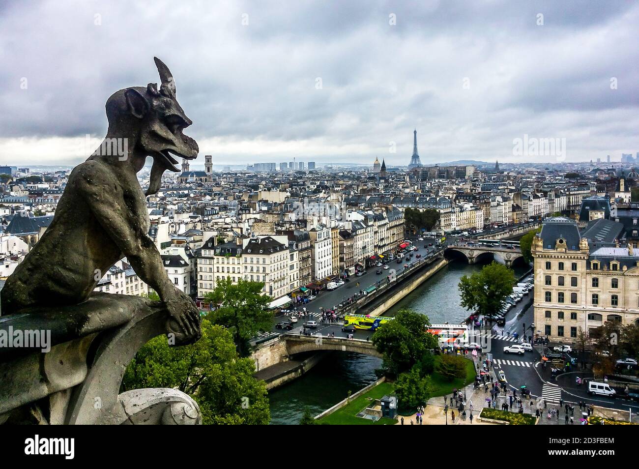 Mythical creature gargoyle on cathedral Notre Dame de Paris. Cityscape ...