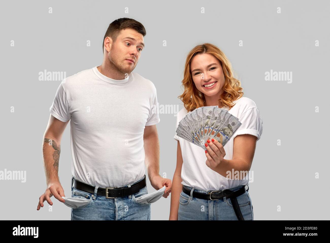 couple with money and empty pockets Stock Photo - Alamy