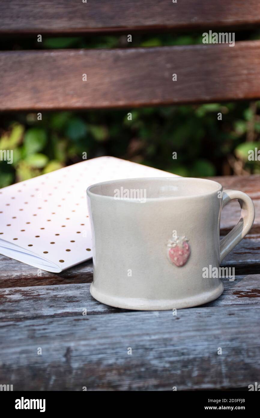 woman reading a notebook on the bench Stock Photo - Alamy
