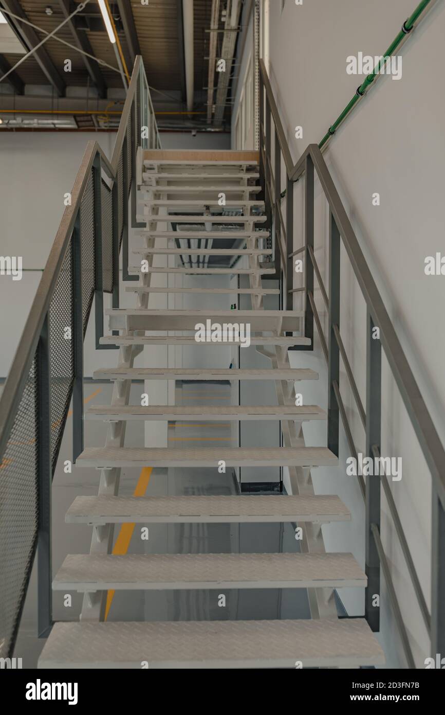 Stairs in a car workshop with exit markings Stock Photo - Alamy