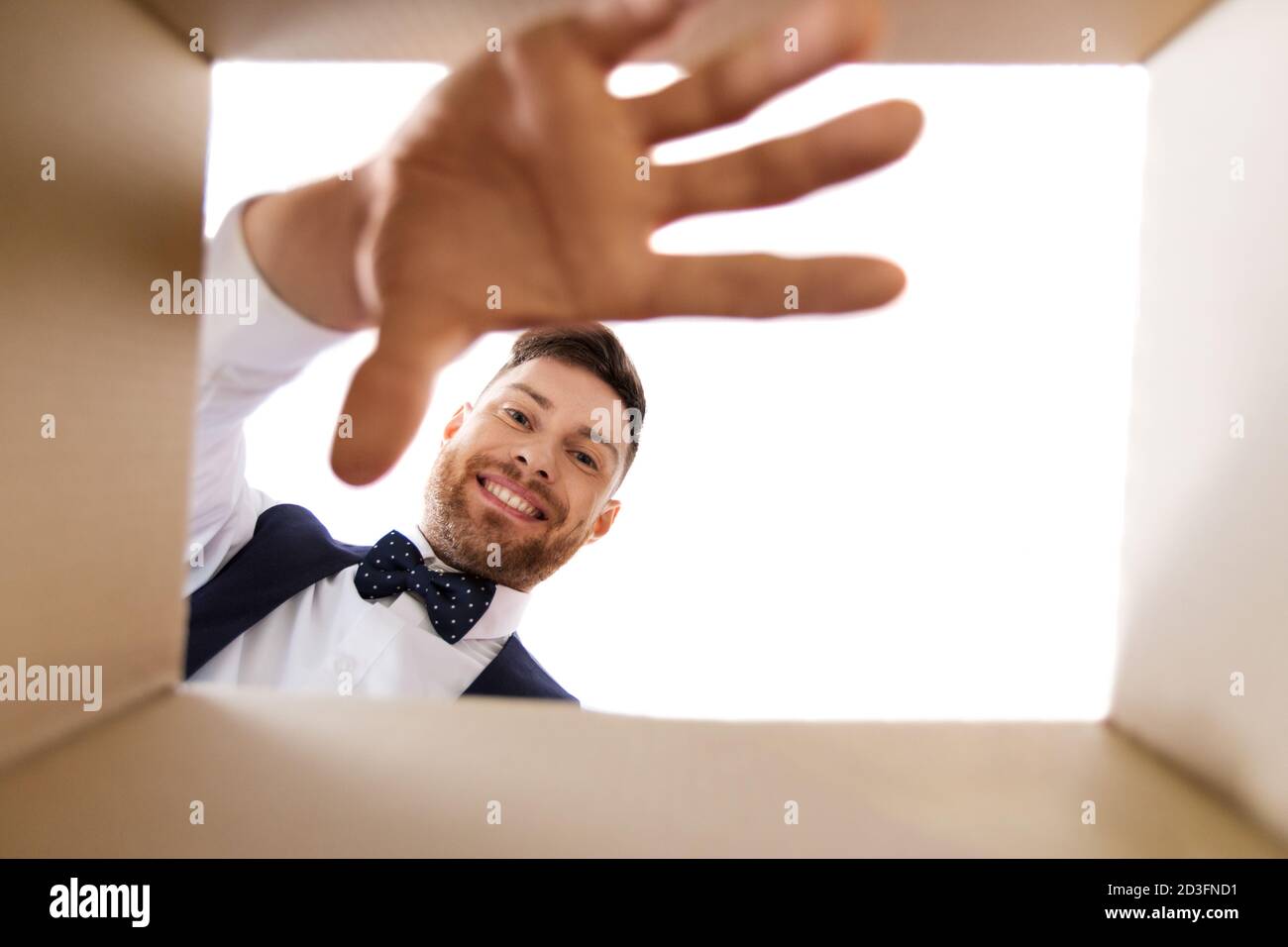 Hand reaching into box hi-res stock photography and images - Alamy