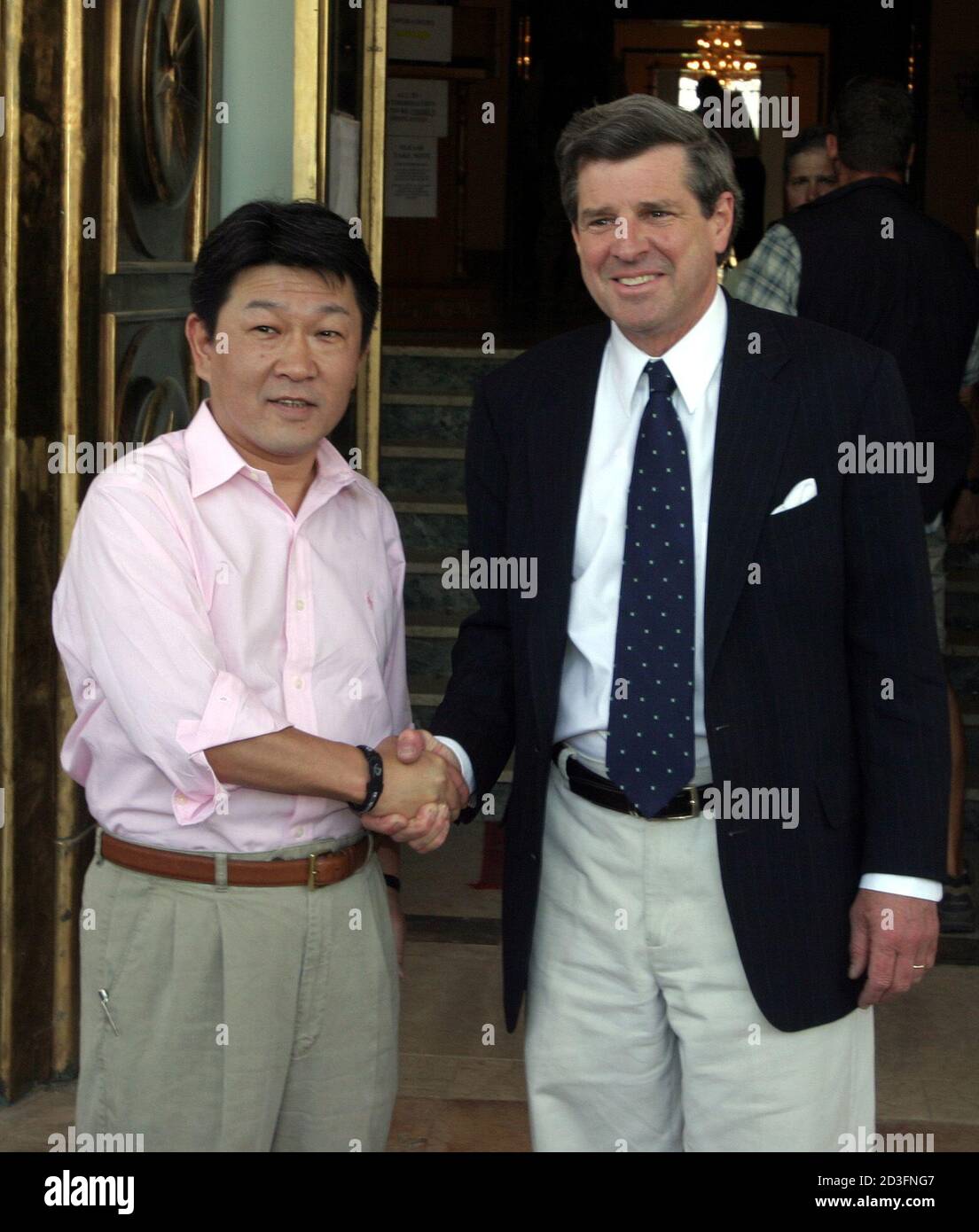 New U.S. civilian administrator to Iraq L. Paul Bremer (R) greets ...