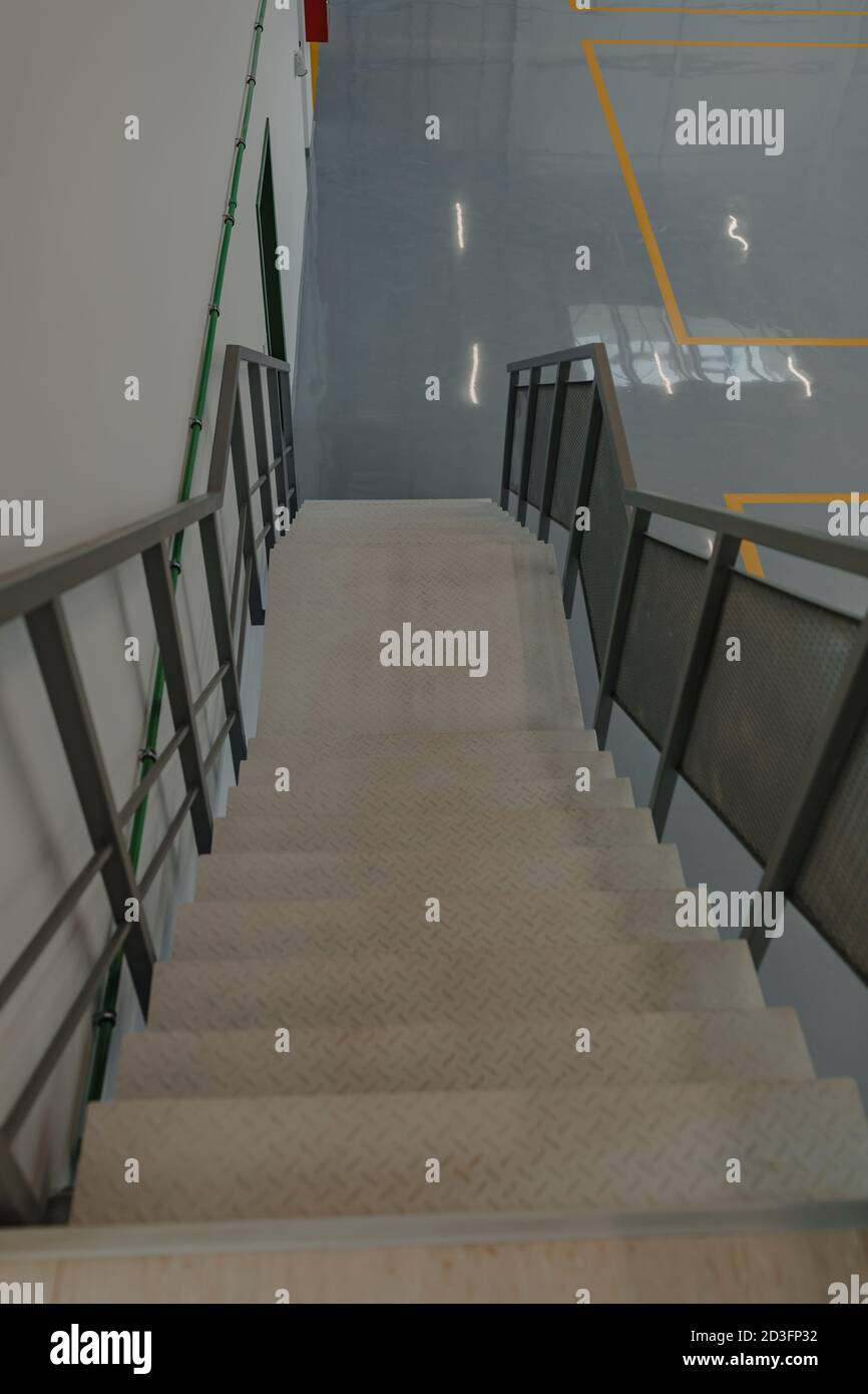 Stairs in a car workshop with exit markings Stock Photo - Alamy