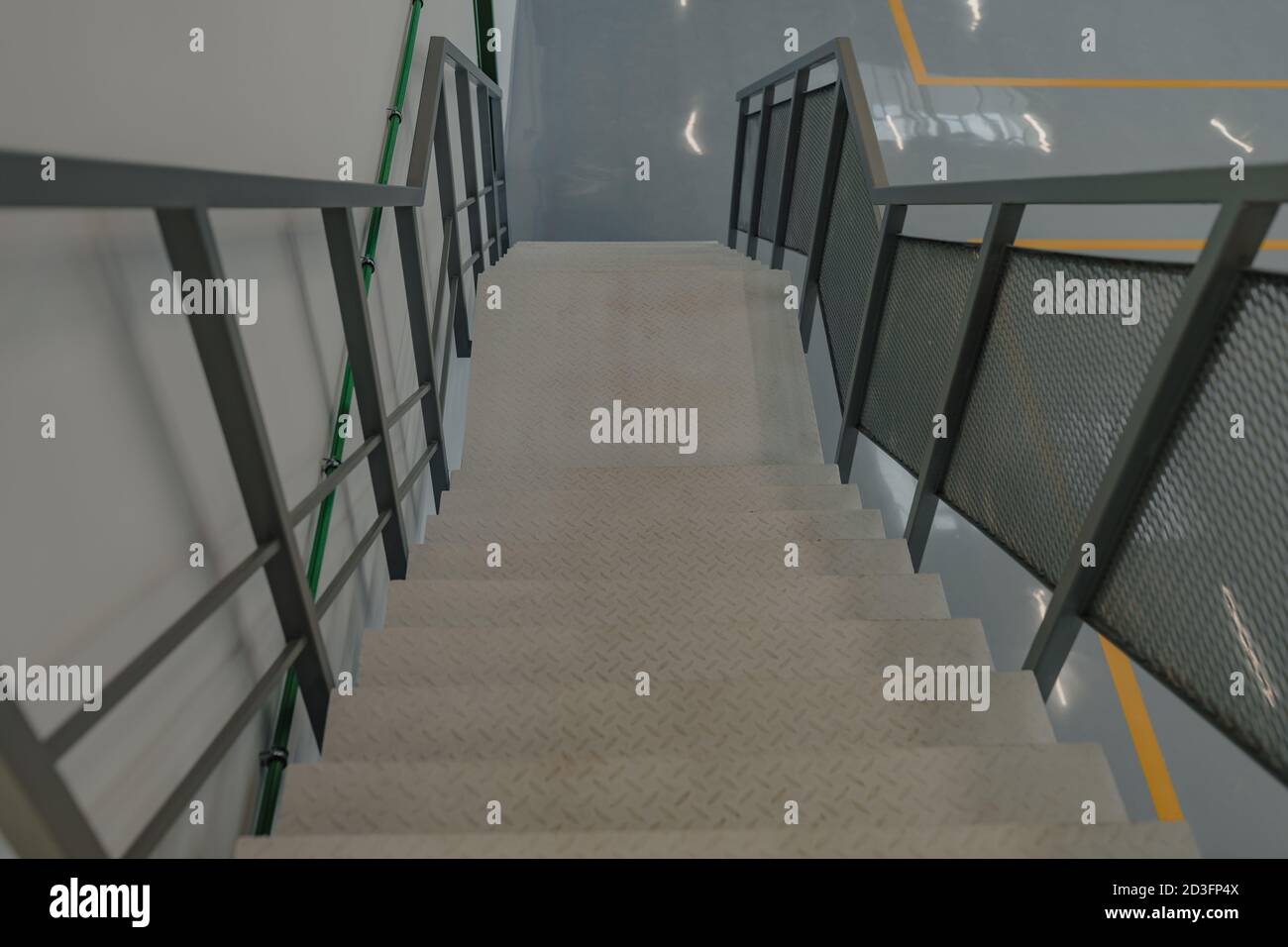 Stairs in a car workshop with exit markings Stock Photo - Alamy
