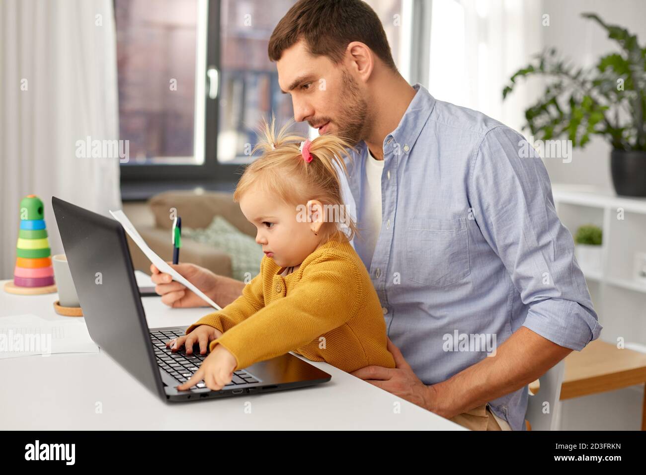 working father with baby daughter at home office Stock Photo - Alamy