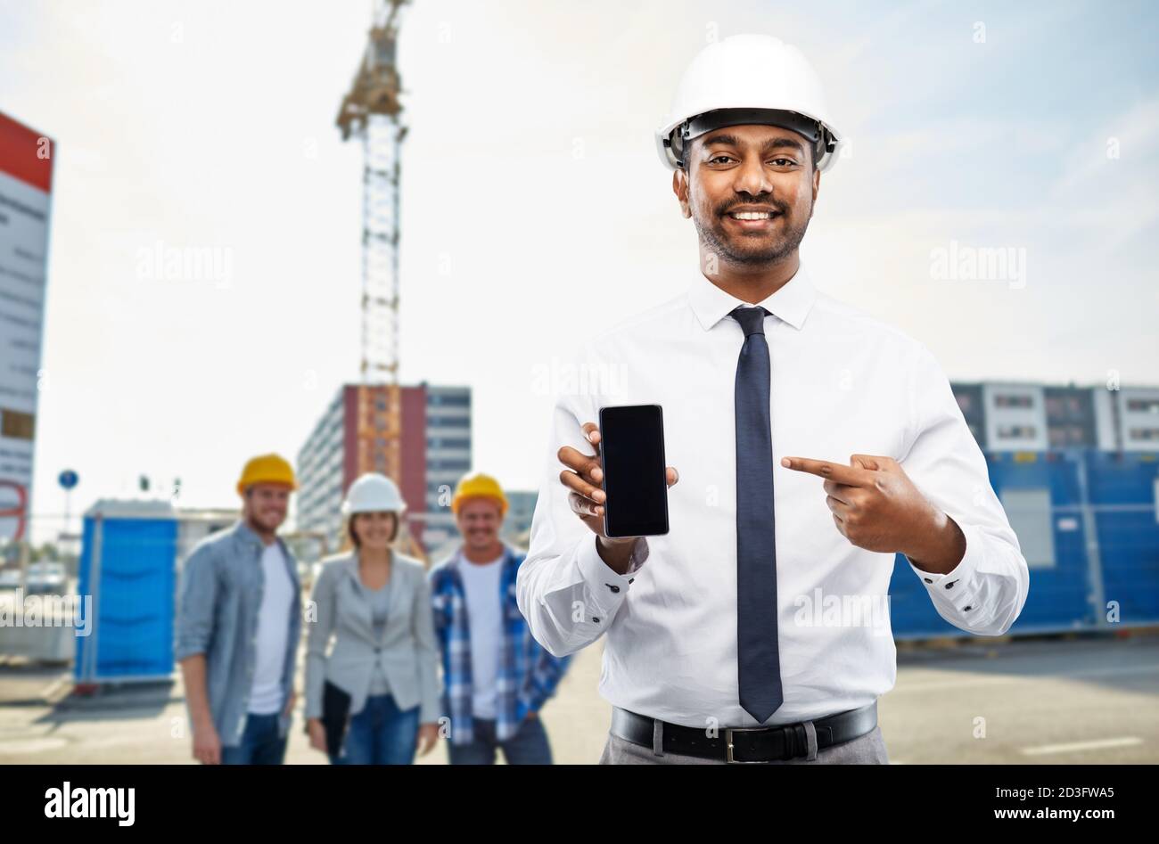 architect showing smartphone at construction site Stock Photo - Alamy