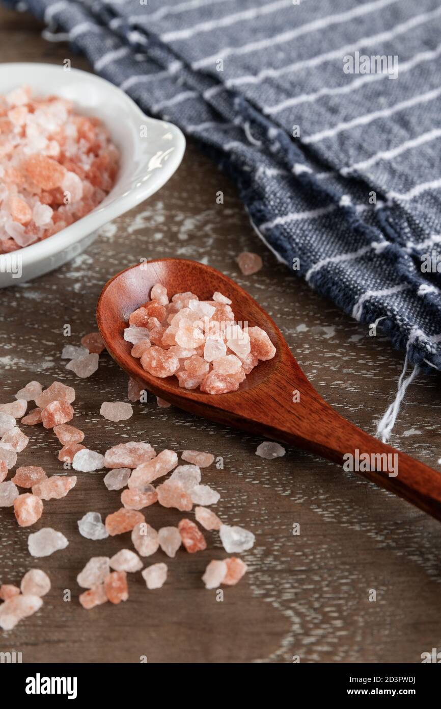 Pink himalayan salt on rustic background Stock Photo - Alamy