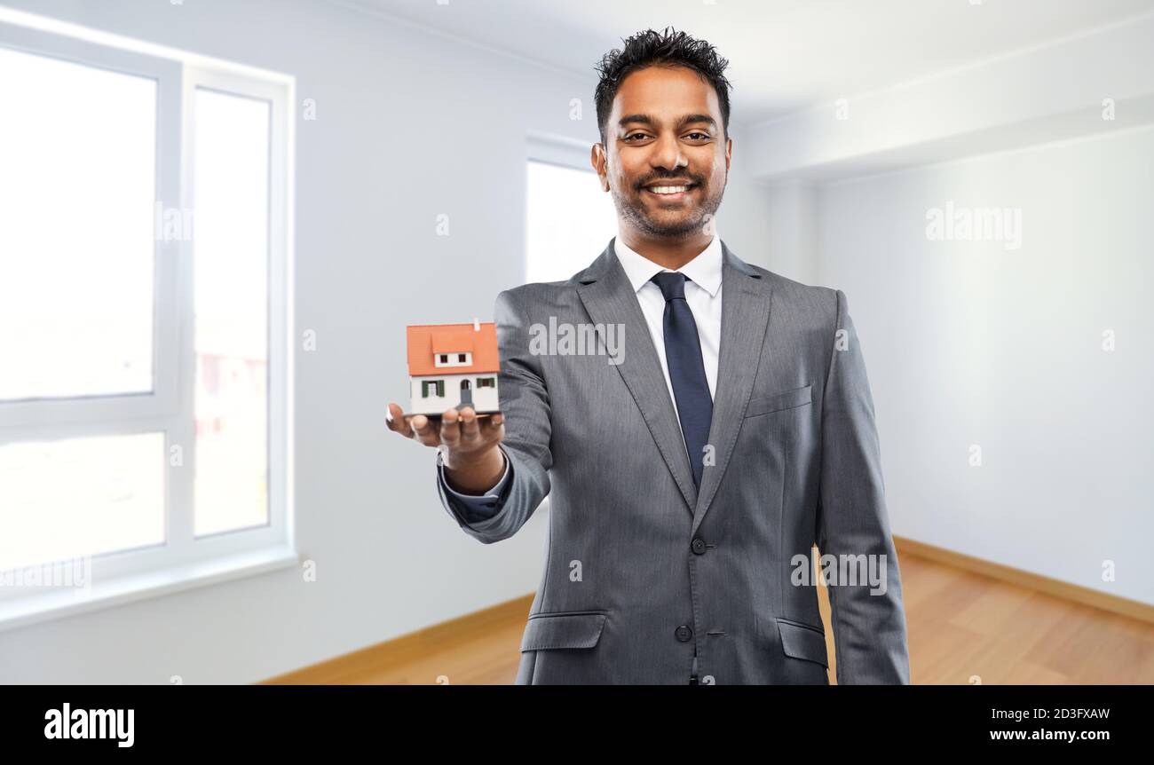 indian man realtor with house model at new home Stock Photo - Alamy