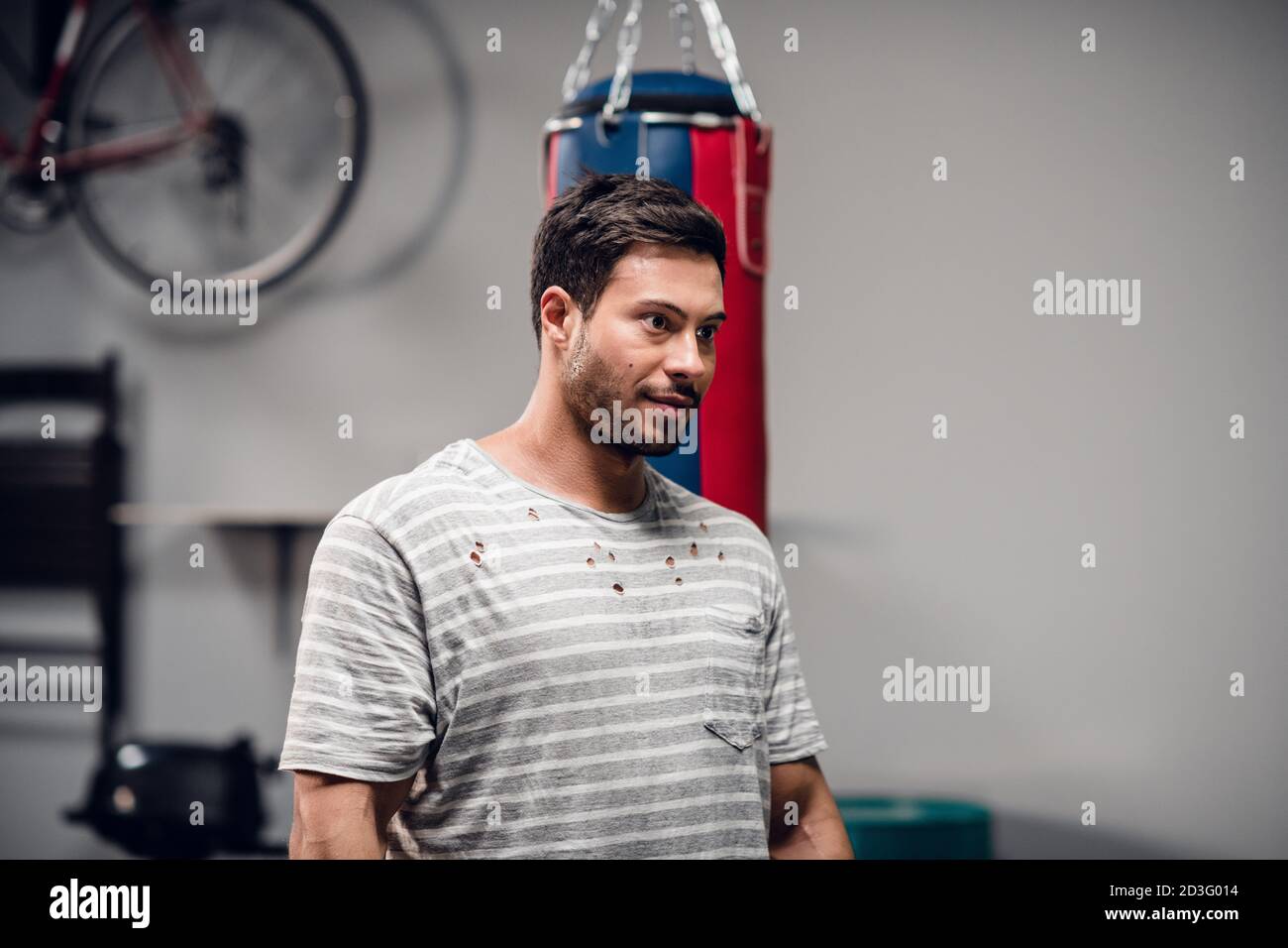 Boxing coach a young male boxer sets up for training in the gym Stock ...