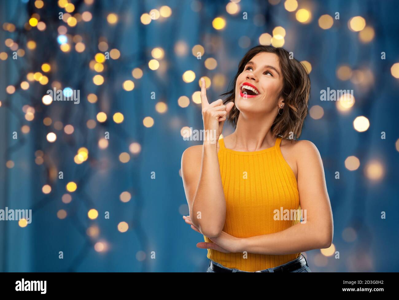 happy smiling young woman pointing finger up Stock Photo - Alamy happy smiling young woman pointing finger up Stock Photo - Alamy