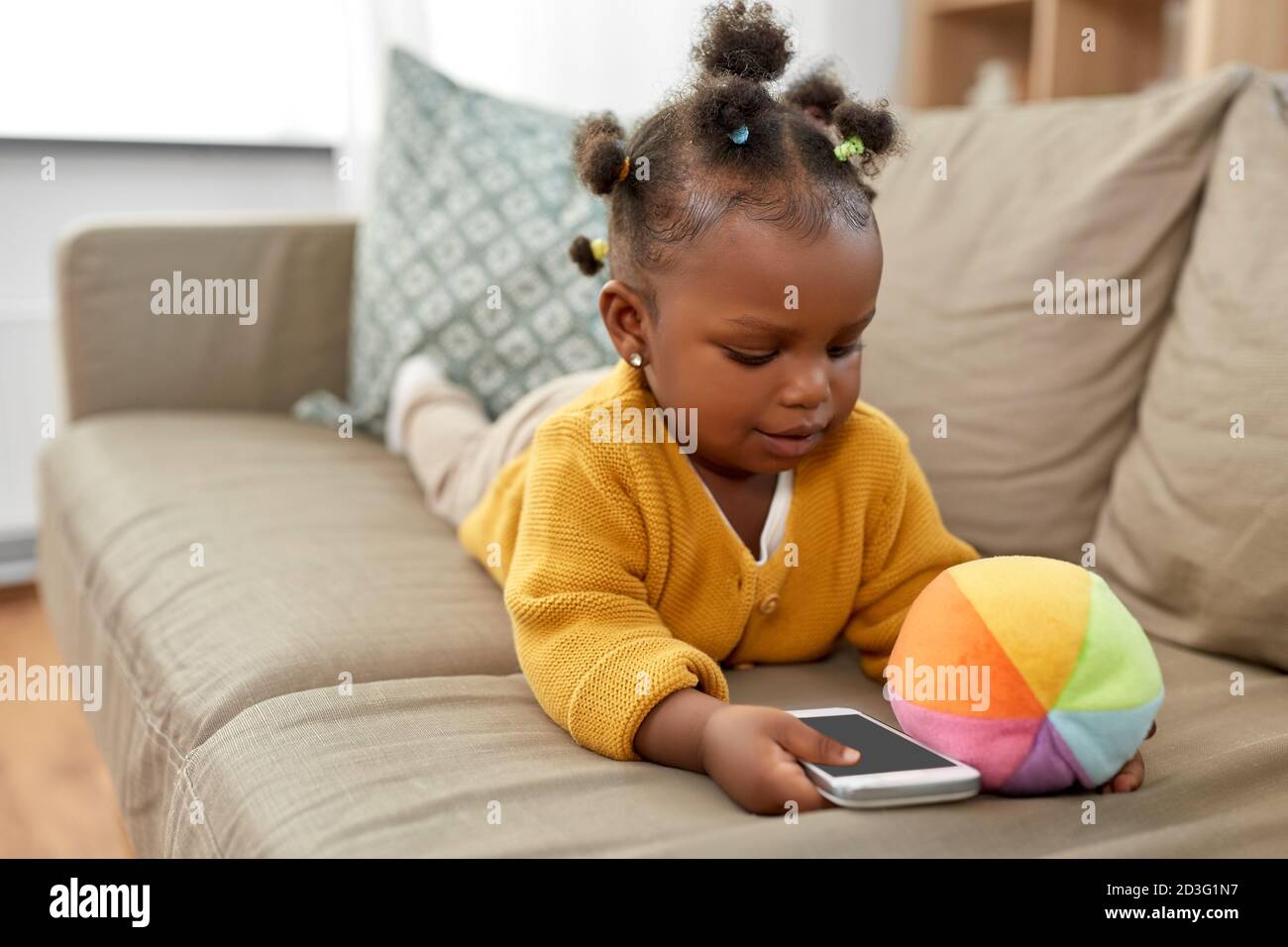 african american baby girl with smartphone at home Stock Photo - Alamy