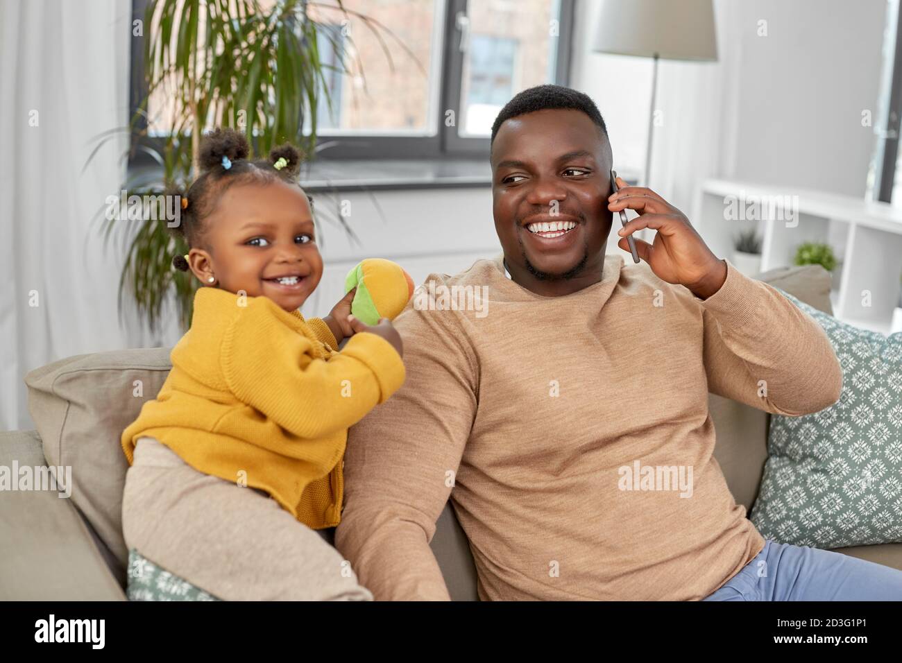 father with baby at home calling on smartphone Stock Photo - Alamy