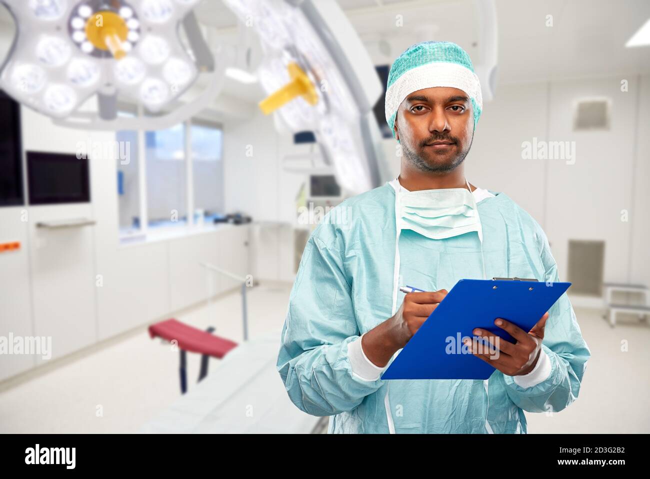 indian male surgeon with clipboard at hospital Stock Photo - Alamy