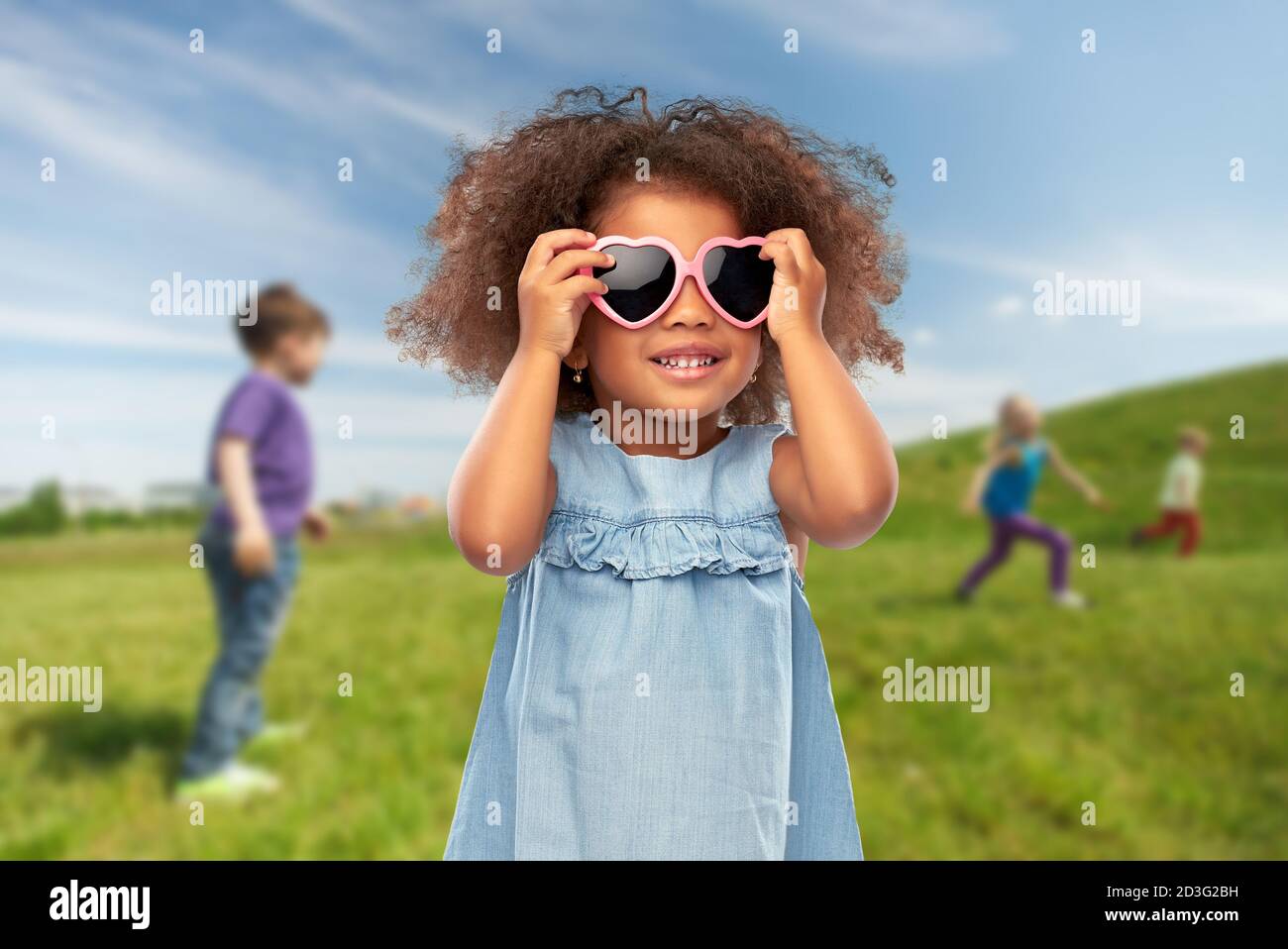 little african girl in heart shaped sunglasses Stock Photo - Alamy