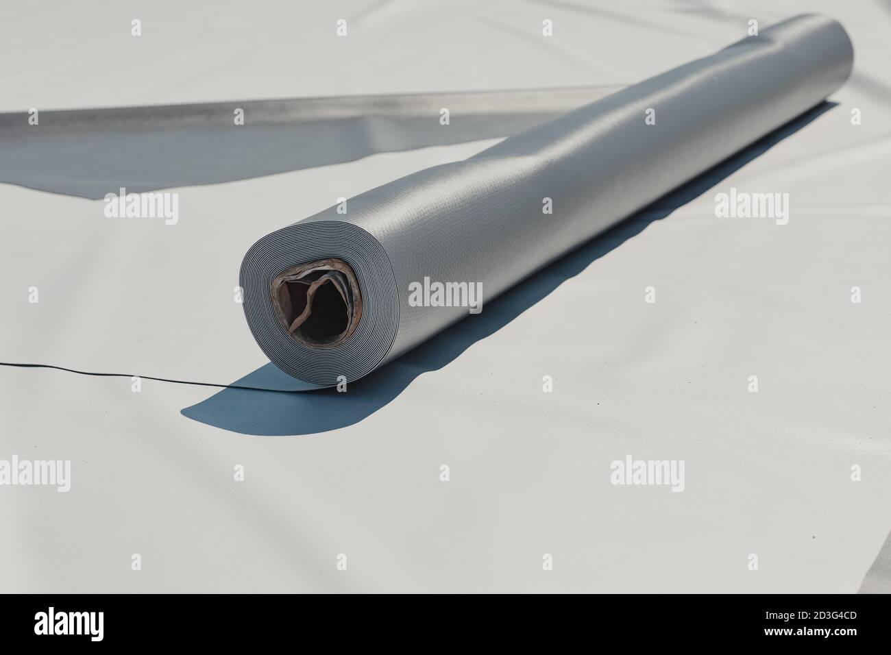 Roofing PVC membrane in rolls placed on the roof of a hall.Rubber ...