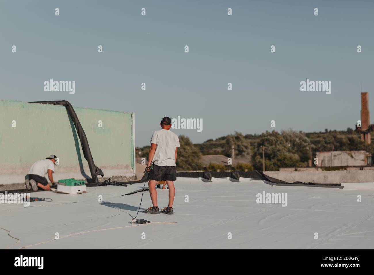 Worker welding pvc roof membrane by heater with welder machine Stock ...