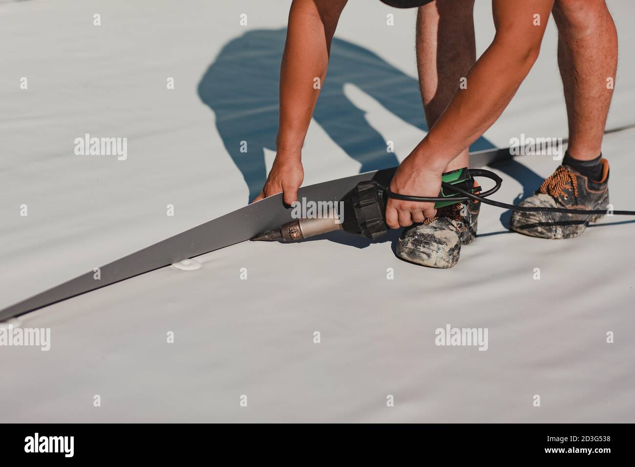 Worker welding pvc roof membrane by heater with welder machine Stock ...