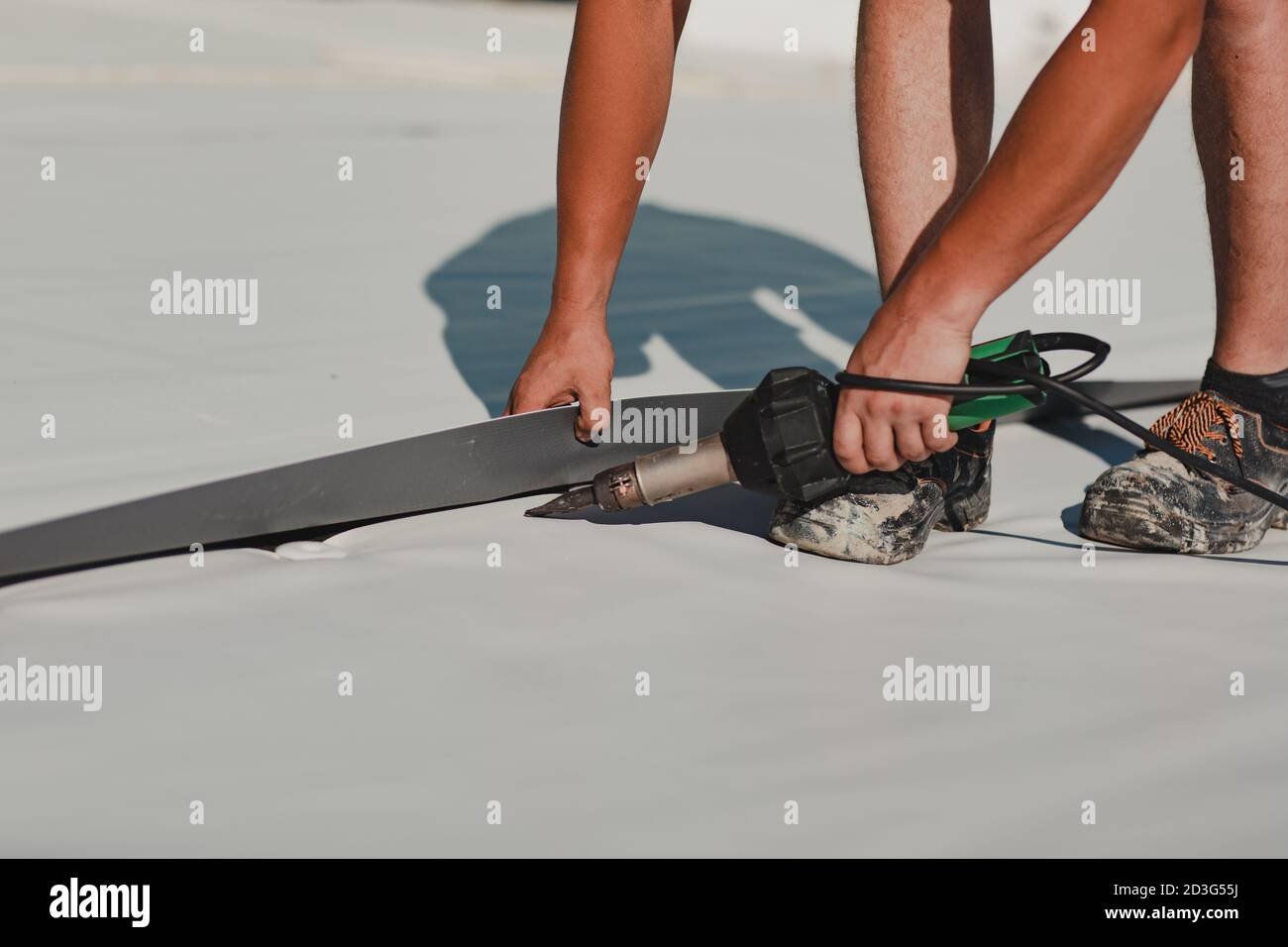 Worker welding pvc roof membrane by heater with welder machine Stock ...