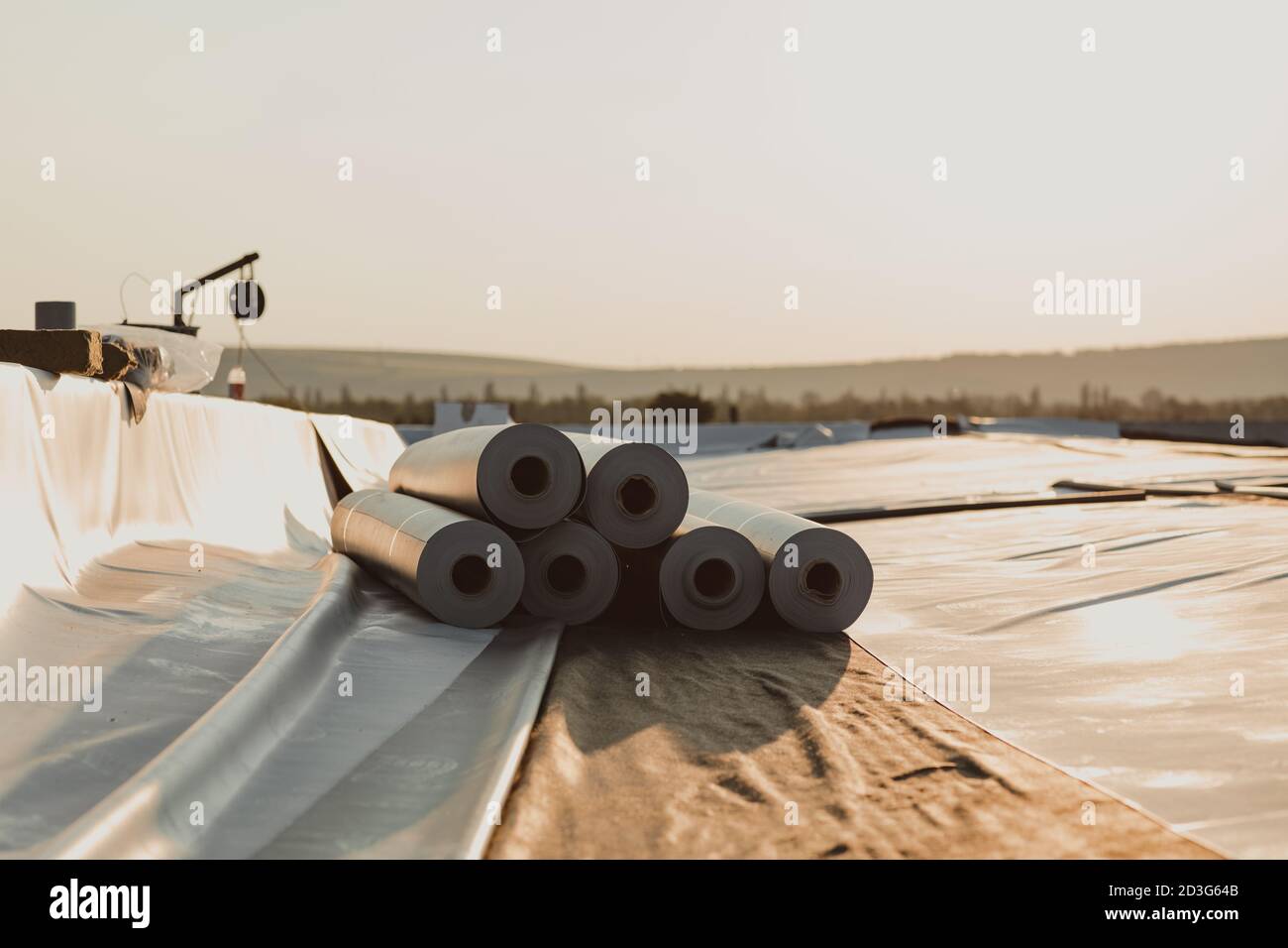 Roofing PVC membrane in rolls placed on the roof of a hall.Rubber ...