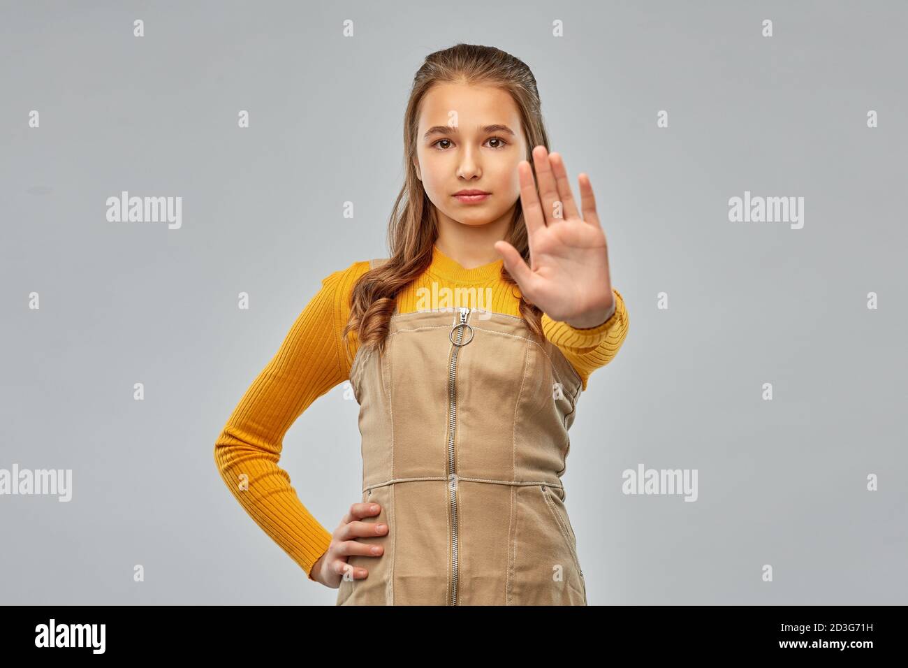 teenage girl making stopping gesture Stock Photo - Alamy
