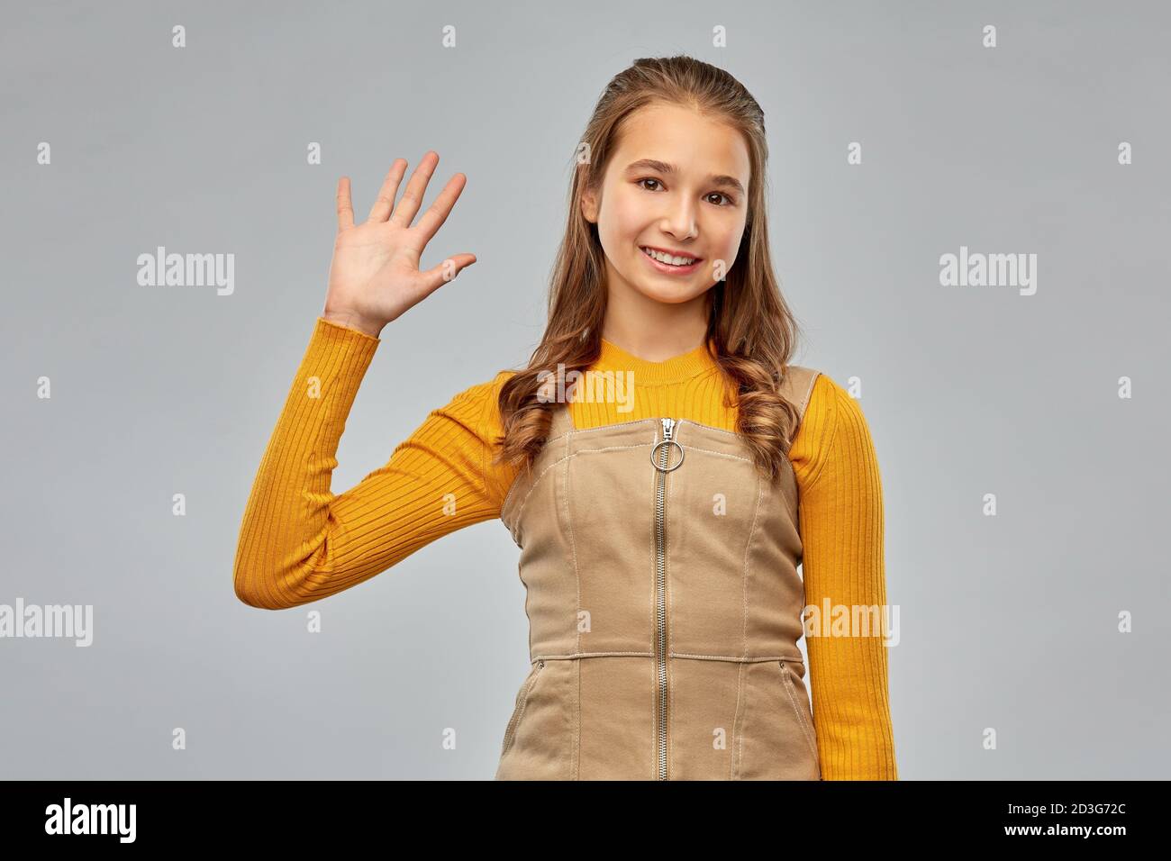 happy smiling young teenage girl waving hand Stock Photo - Alamy
