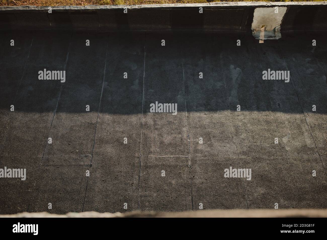 Bitumen roof on an industrial hall combined with tin attic Stock Photo ...