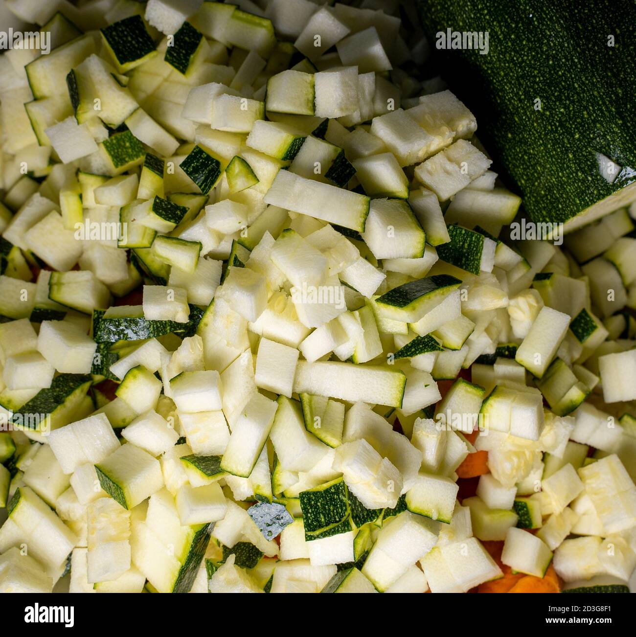 Zucchini cut into pieces background. Top view. Food texture Stock Photo ...