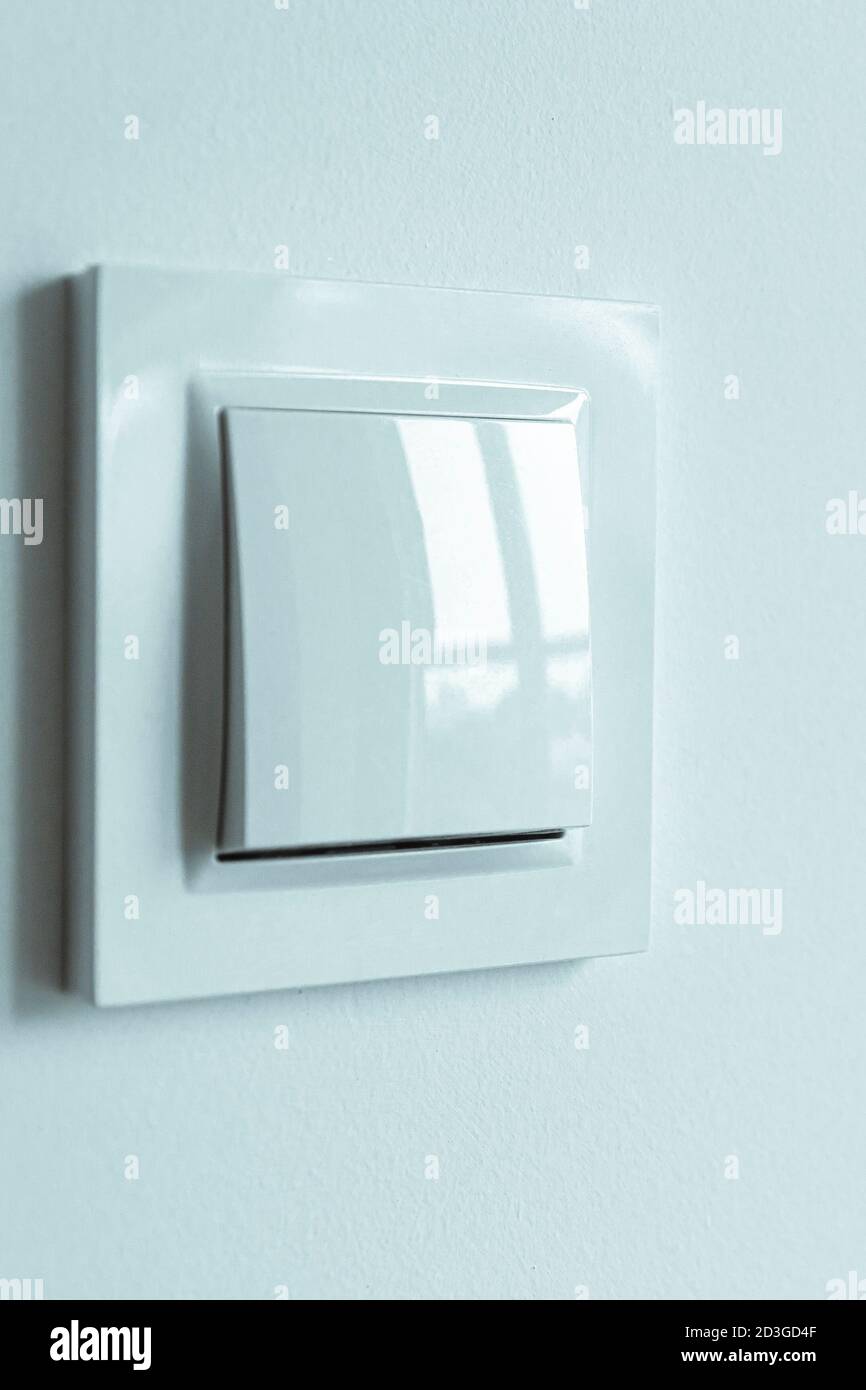 A white plastic power switch in an apartment on a white wall Stock ...