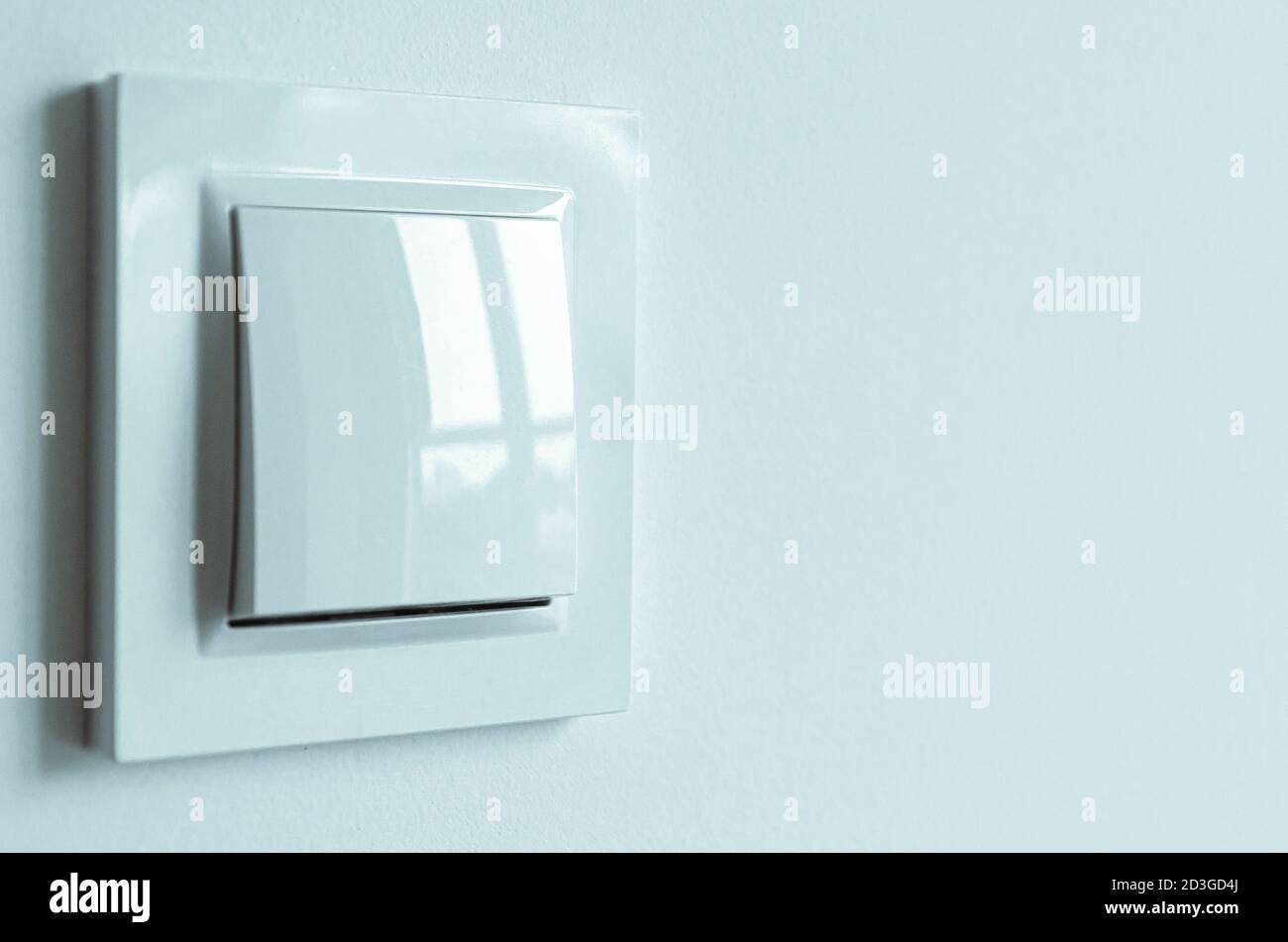 A white plastic power switch in an apartment on a white wall Stock ...