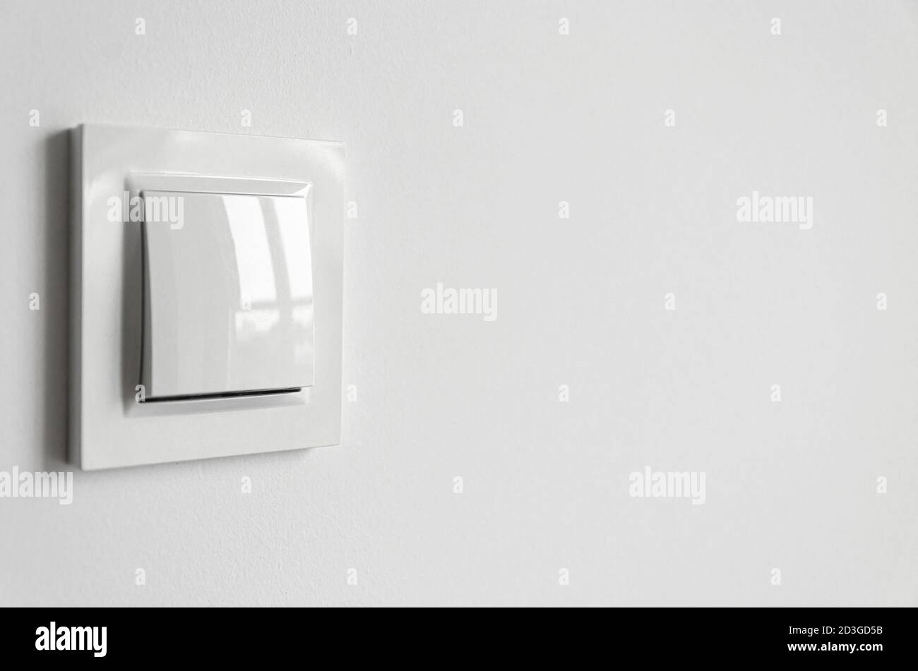 A white plastic power switch in an apartment on a white wall Stock ...