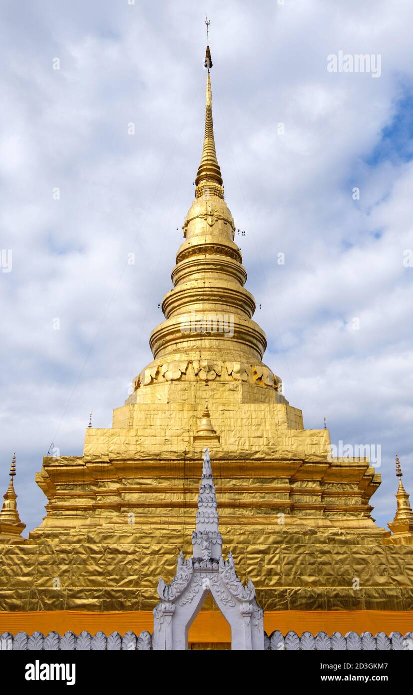 Front view of the large golden pagoda in the traditional northern Thai ...