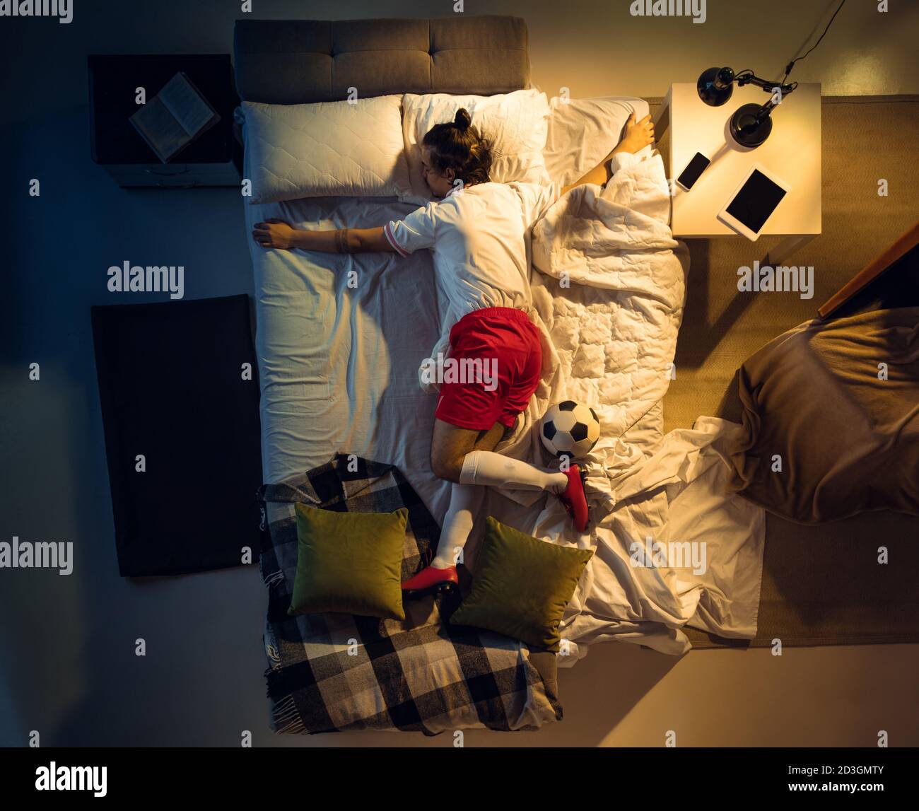 In love. Top view of young professional football, soccer player ...