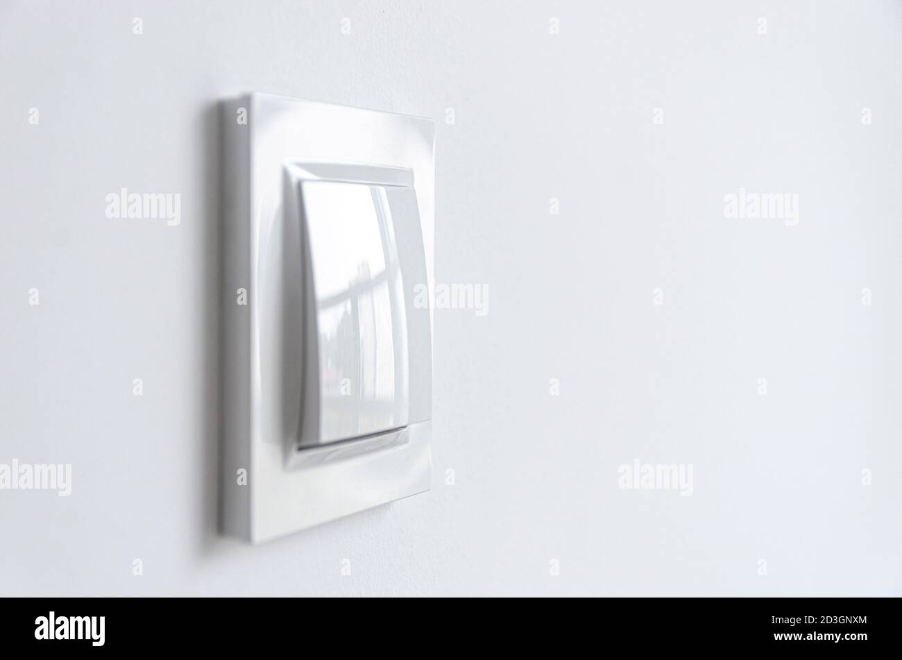 A white plastic power switch in an apartment on a white wall Stock ...