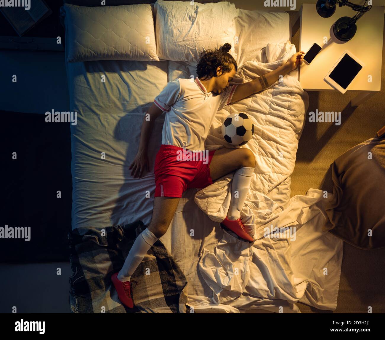 Champion. Top view of young professional football, soccer player ...