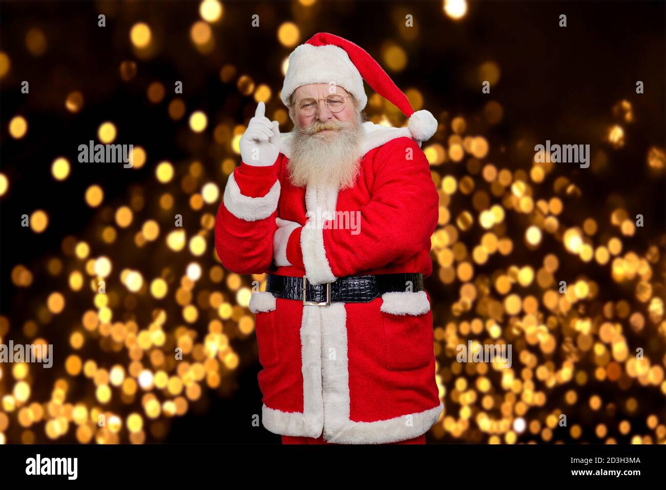 Santa Clause raised index finger Stock Photo - Alamy