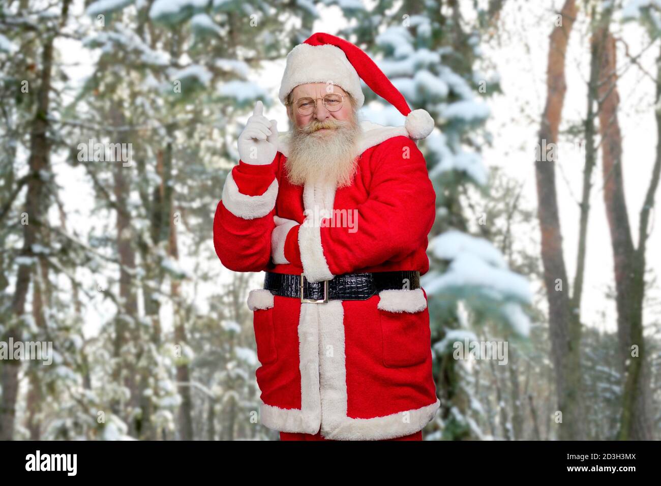 Santa Claus raised index finger upwards Stock Photo - Alamy
