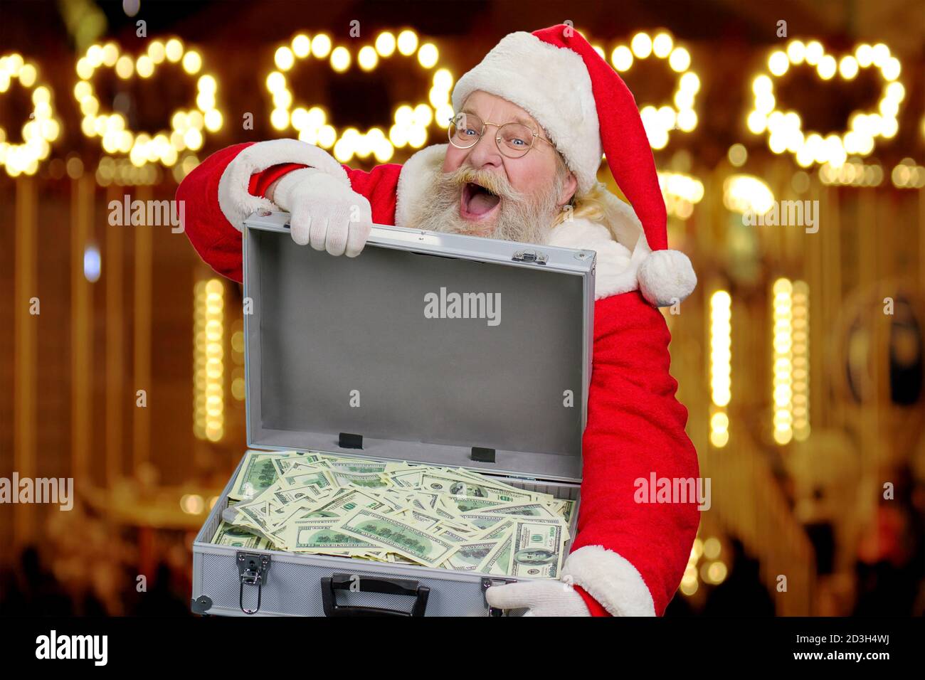 Santa Claus with case full of cash Stock Photo - Alamy