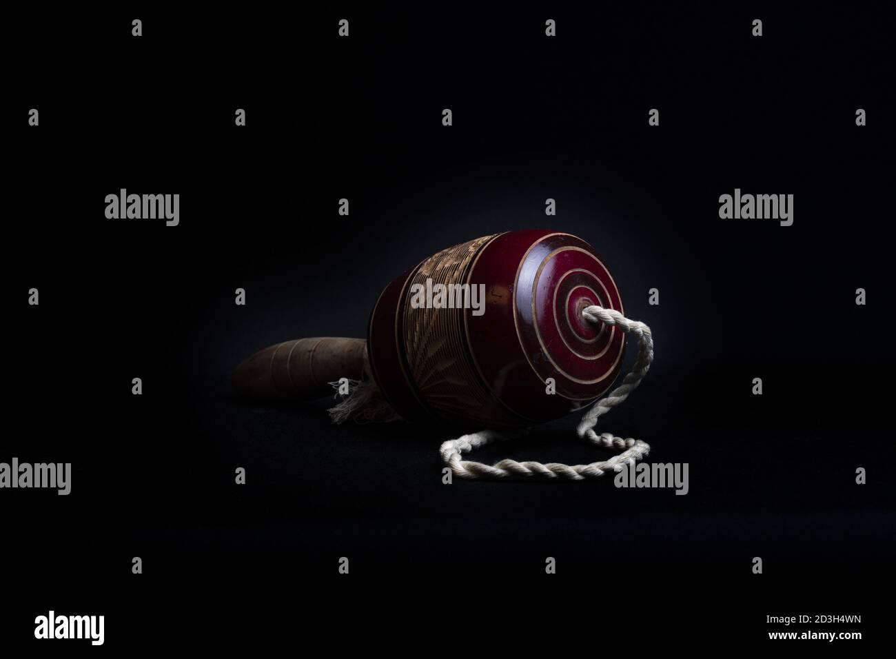 Closeup of a balero, a multi-colored wooden Mexican traditional toy ...