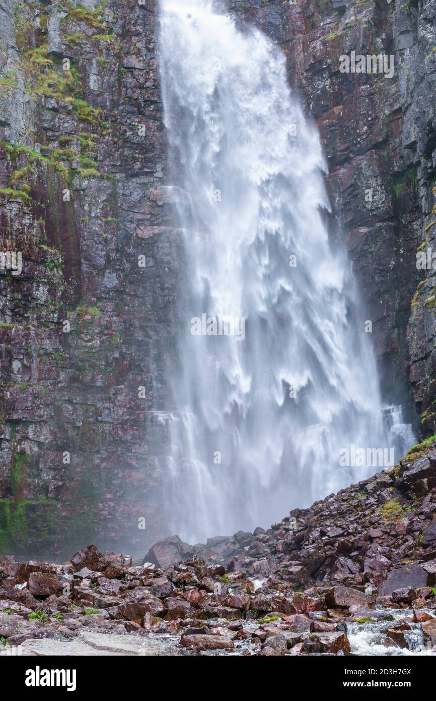 High waterfall falling down at a rock wall Stock Photo - Alamy