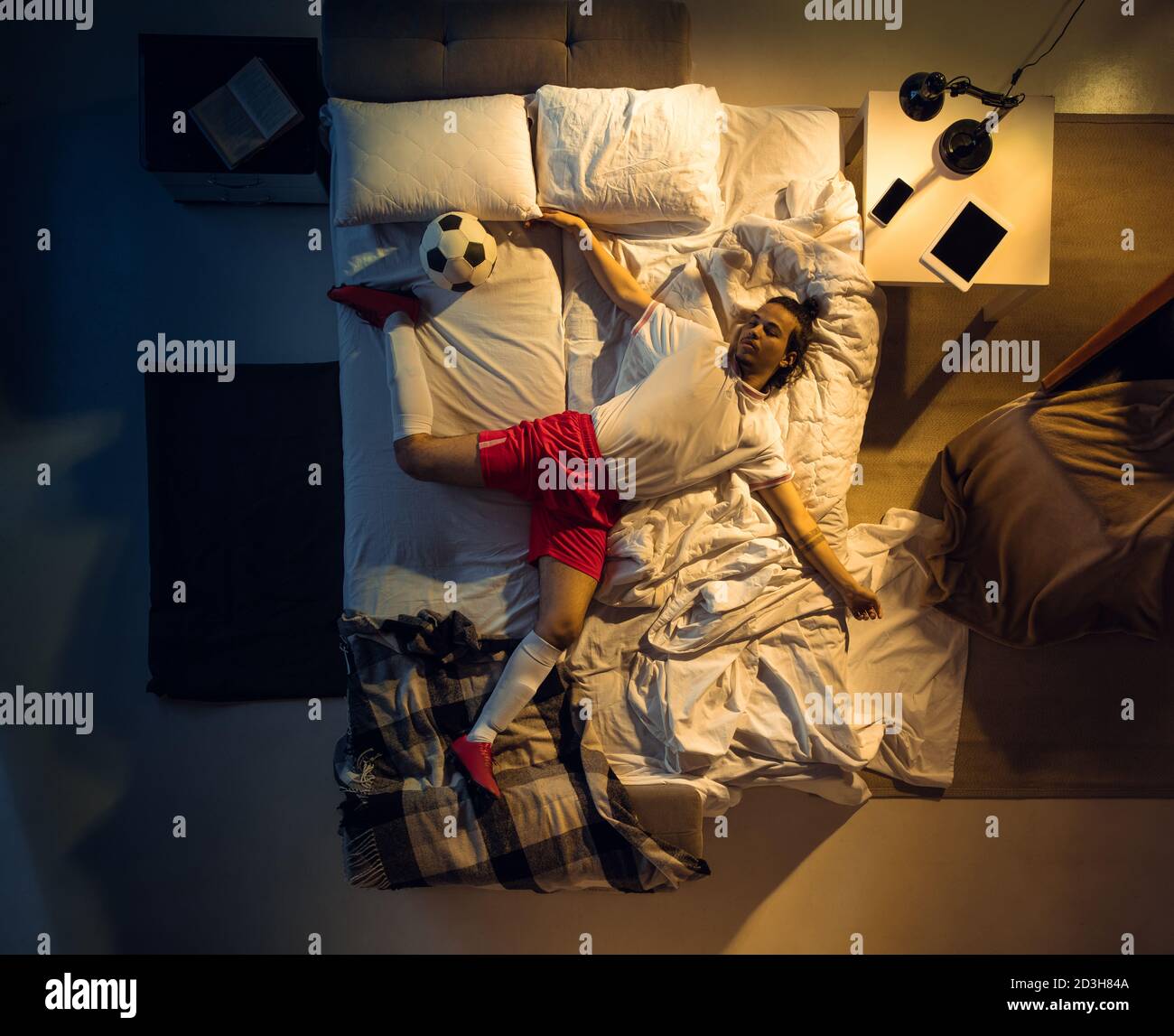 Comfort. Top view of young professional football, soccer player ...