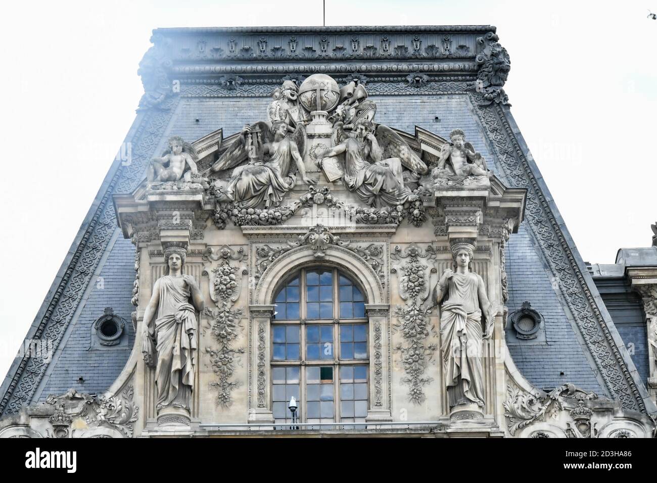 Sculptures on a wall of the Louvre museum Paris Stock Photo - Alamy