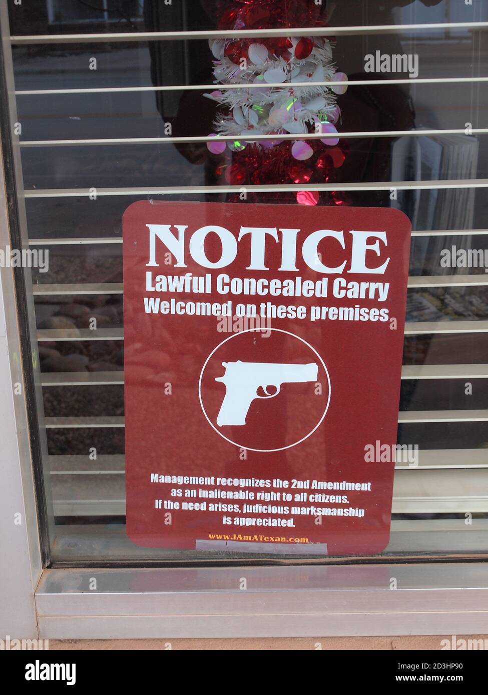 Open carry sign allowing for weapons on the front of a Texas store ...