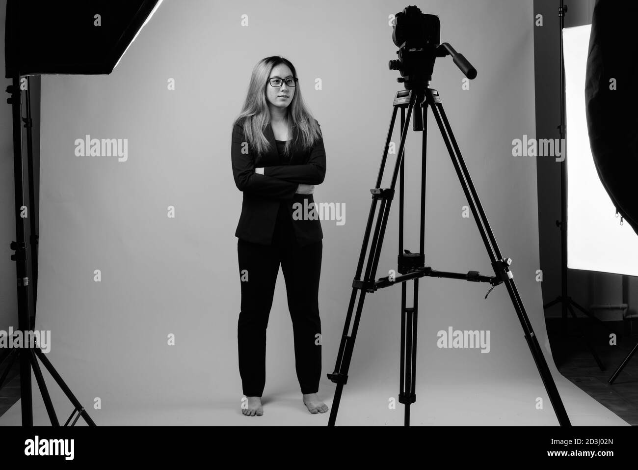 Portrait of young Asian businesswoman vlogging with camera Stock Photo ...