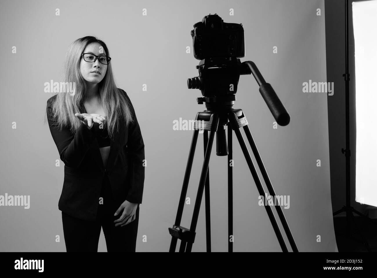 Portrait of young Asian businesswoman vlogging with camera Stock Photo ...