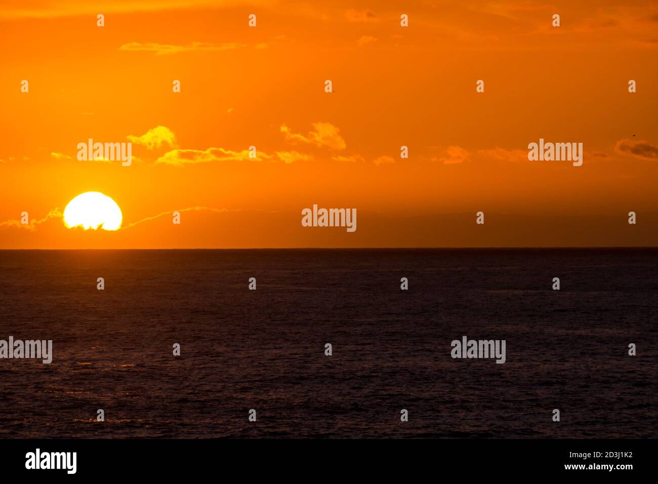 Sun Setting on the Ocean Stock Photo - Alamy